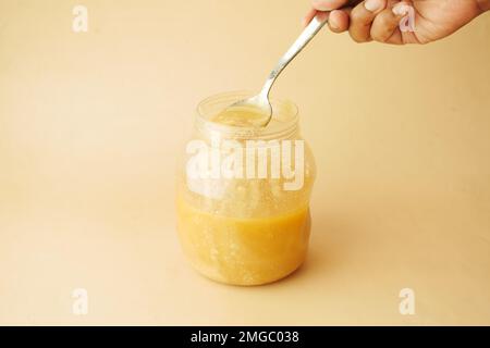 homemade ghee in container on a table Stock Photo - Alamy