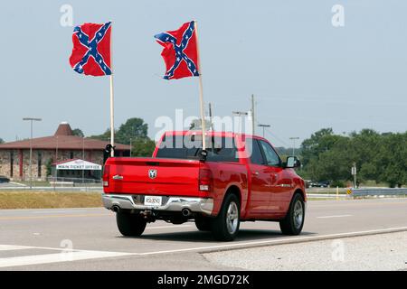 A truck flying confederate flags passes the main entrance to Talladega ...