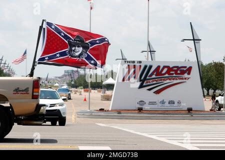 A truck flying confederate flags passes the main entrance to Talladega ...