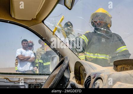 A Royal Saudi Air Force firefighter fits his helmet between two U.S ...