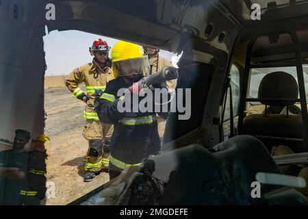 A Royal Saudi Air Force firefighter fights a fire during training with ...