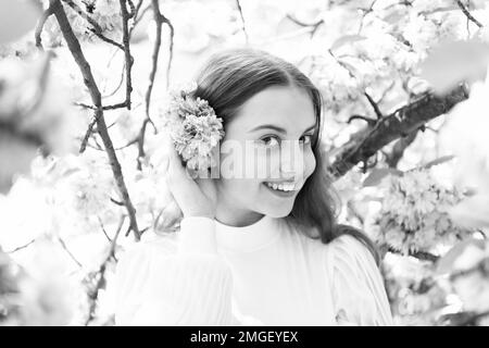 positive teen girl at sakura flower bloom in spring Stock Photo - Alamy