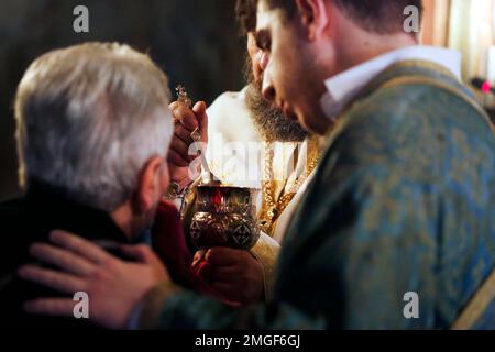 Greek Orthodox Holy Communion With Spoon Stock Photo - Alamy