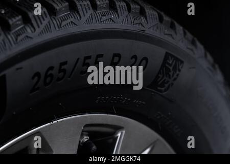 Close up view of tire with tire width, height and wheel diameter ...