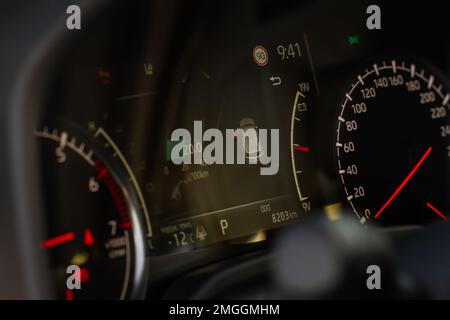 Color detail of an error message on a car dashboard. Door opened alarm ...