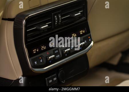 Modern car. Digital second row seat temperature control. Car air ...
