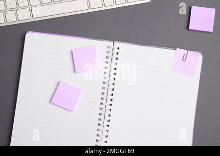 Colored paper with important message lying desk near keyboard. Main ...