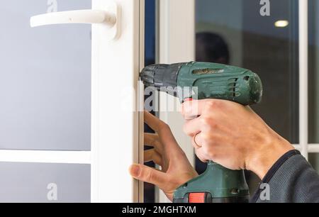 Man with screwdriver. Clouseup concept Stock Photo - Alamy