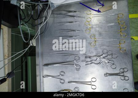 many different cleaned instruments for performing vascular surgery lie ...
