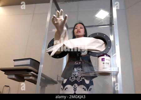 Dr. Sherry Yu demonstrates a free-standing booth for COVID-19 testing ...