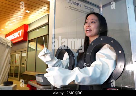 Dr. Sherry Yu demonstrates a free-standing booth for COVID-19 testing ...