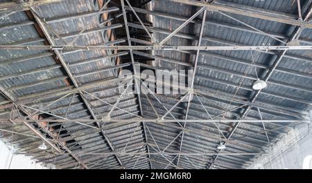 Gable roof truss of a large, vintage factory hall. Roofing construction ...