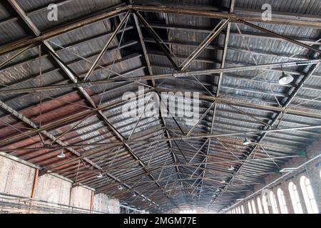 Gable roof truss of a large, vintage factory hall. Roofing construction ...