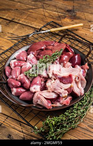 Raw bird hearts meat set, on white stone table background, top view ...