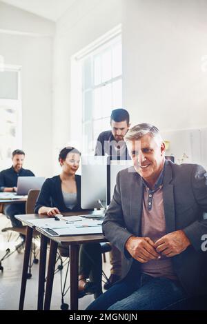Old male employee working at workplace Stock Photo - Alamy