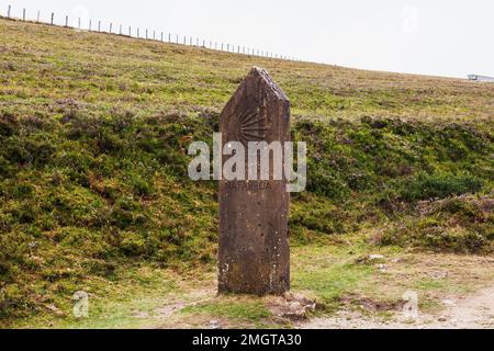 Way Marking Stone Post with Scallop Shell Symbol and Yellow Arrow Sign ...