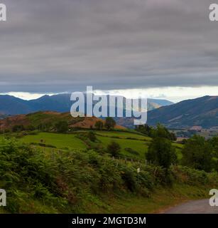 clouds floating over tops of mountains on blue background Stock Photo ...
