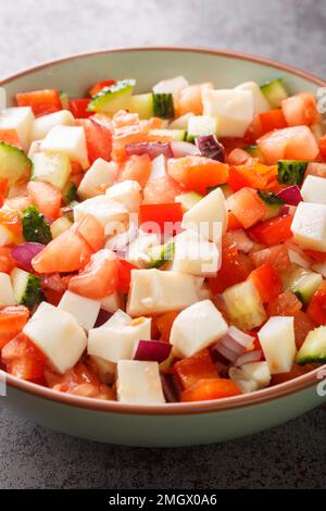 snail eating cucumber on a white background Stock Photo - Alamy