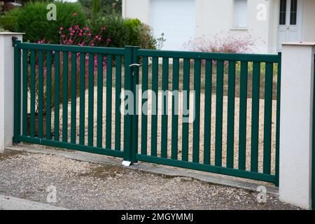 Aluminum large car gate of modern house in street view Stock Photo - Alamy