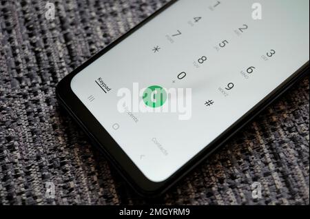 Mobile phone with green screen on empty wooden plank table. Blank ...