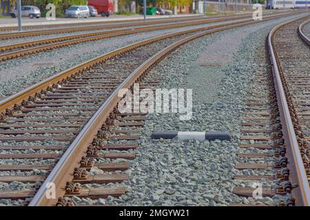 Train mark on railroad track close up Stock Photo - Alamy