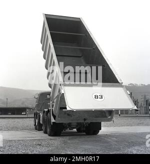 1950s, historical, outside at a steelworks, picture shows a new dump ...