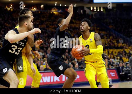 Marquette's Sacar Anim (2) drives to the basket against Butler's Henry ...