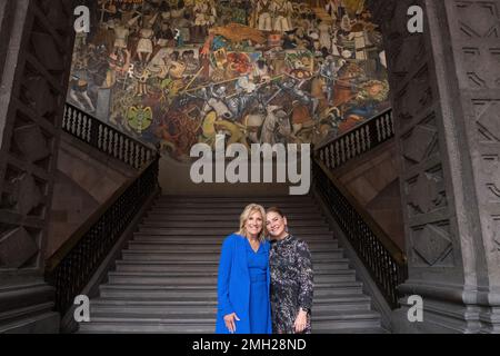 First Lady Jill Biden poses for a photo by Diego Rivera’s mural “The ...