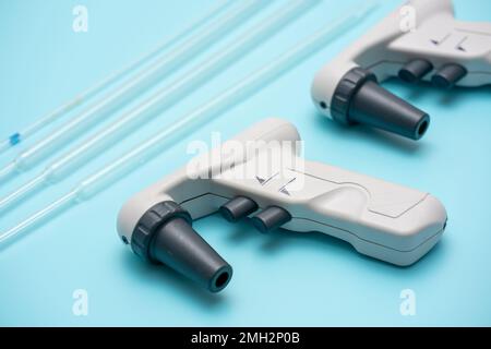 automatic electric pipette for scientific laboratory Stock Photo - Alamy