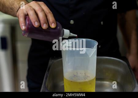 Cook mixing eggs and agar agar. whisk eggs Stock Photo - Alamy
