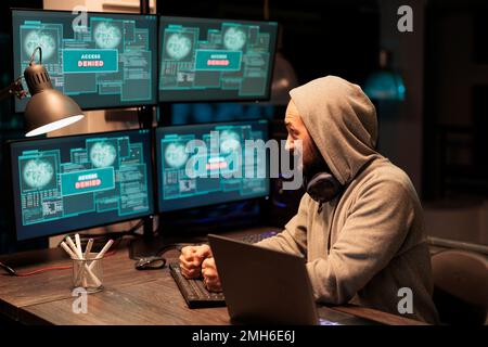 Displeased angry hacker throwing keyboard in office, feeling mad about hacking system failure ...