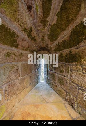 Narrow medieval window in thick stone wall of ruins of Clare Abbey in ...