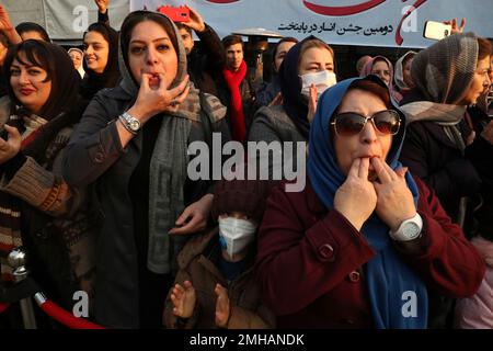 Iranian Kurd performers in traditional attire dance a traditional ...