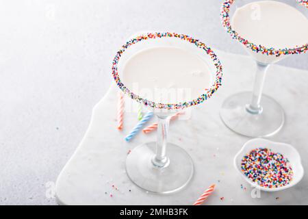 Birthday cake martini with sprinkles on rim Stock Photo - Alamy