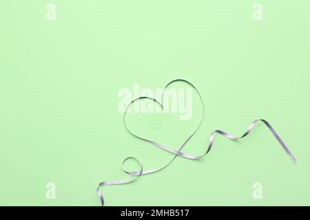 Heart made of white satin ribbon on beige background. Valentine's Day ...