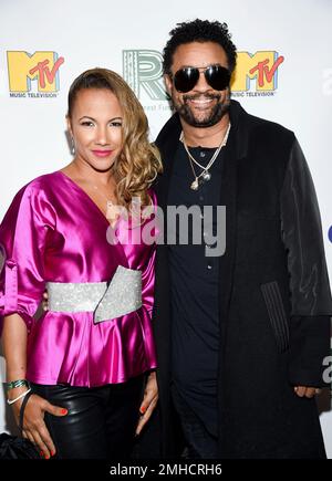 Recording artist Shaggy, right, and wife Rebecca Packer Burrell arrive ...