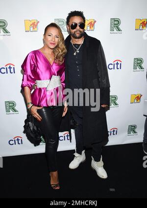 Recording artist Shaggy, right, and wife Rebecca Packer Burrell arrives ...