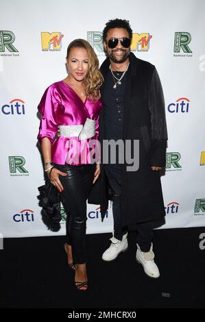 Recording artist Shaggy, right, and wife Rebecca Packer Burrell arrive ...