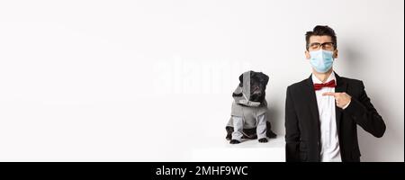 Coronavirus, pets and celebration concept. Disappointed young man in ...