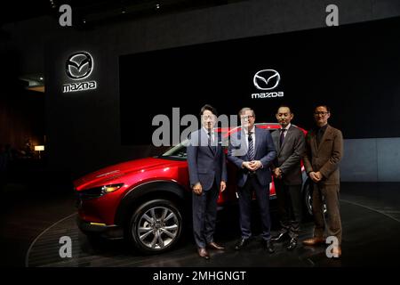 Mazda Executives, from left, Masahiro Moro, Jeffrey Guyton, Naohito ...