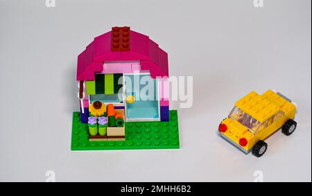 little house built of lego blocks on white table Stock Photo - Alamy