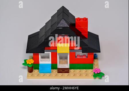 little house built of lego blocks on white table Stock Photo - Alamy