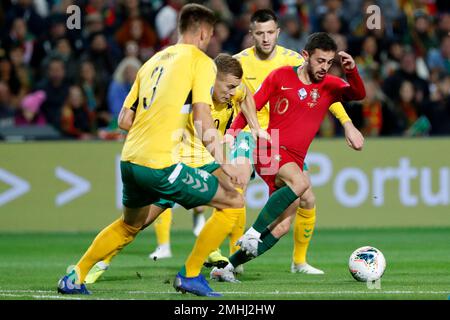 Portugal's Bernardo Silva, right, runs with the ball past Lithuania's ...