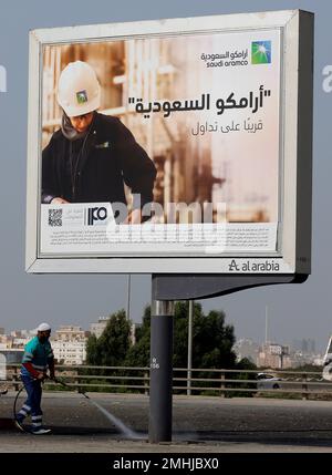 Saudi Arabia's state-owned oil company Aramco employee stands in front ...