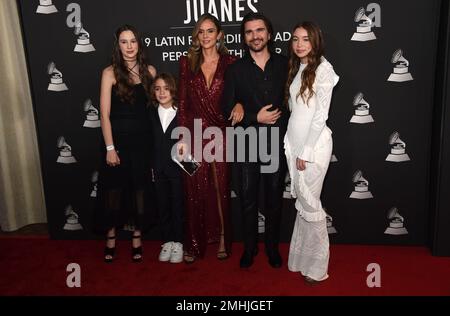 Juanes, from second right, Karen Martinez, and their children, from ...