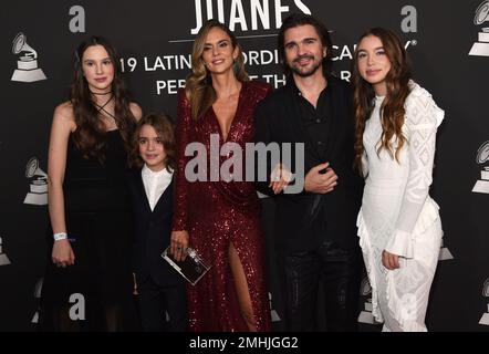 Juanes, from second right, Karen Martinez, and their children, from ...