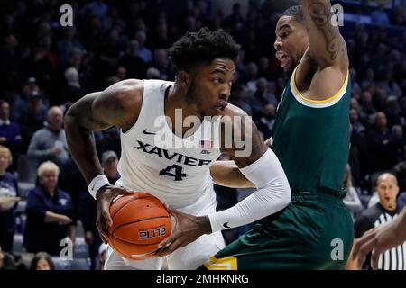 Xavier's Tyrique Jones looks to pass during the first half of an NCAA ...