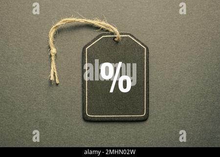 percent sign on the black price tag, black mockup background Stock ...