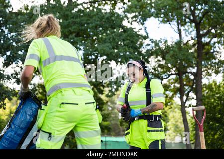 Female workers doing landscaping work Stock Photo - Alamy