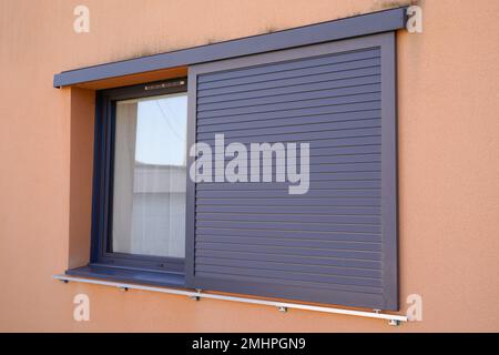 Windows with modern sliding shutters Stock Photo - Alamy